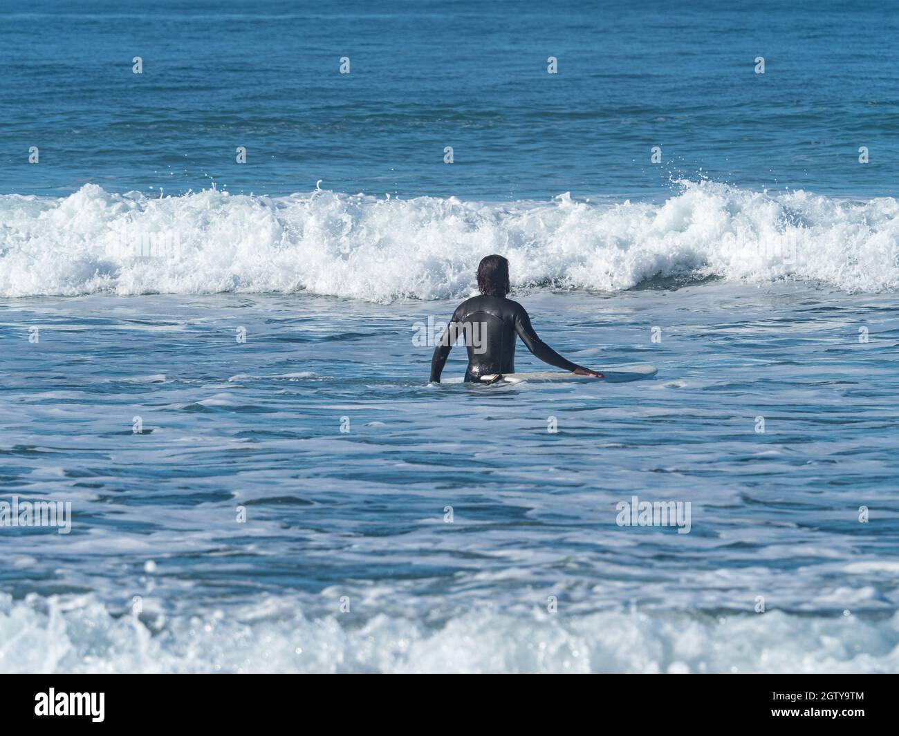 Rear view man body board hi-res stock photography and images - Alamy