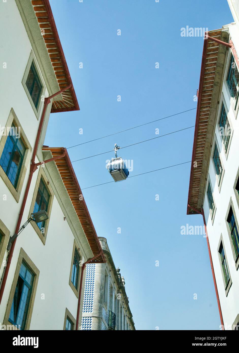 Gaia Cable Car, Porto, Portugal. Seen overhead passing the buildings of ...