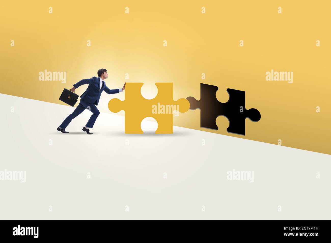 Businessman putting back missing jigsaw puzzle piece Stock Photo - Alamy