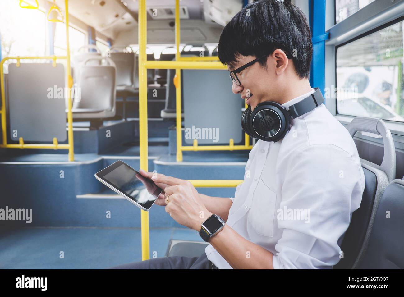 Indian using tablet, bus hi-res stock photography and images - Alamy