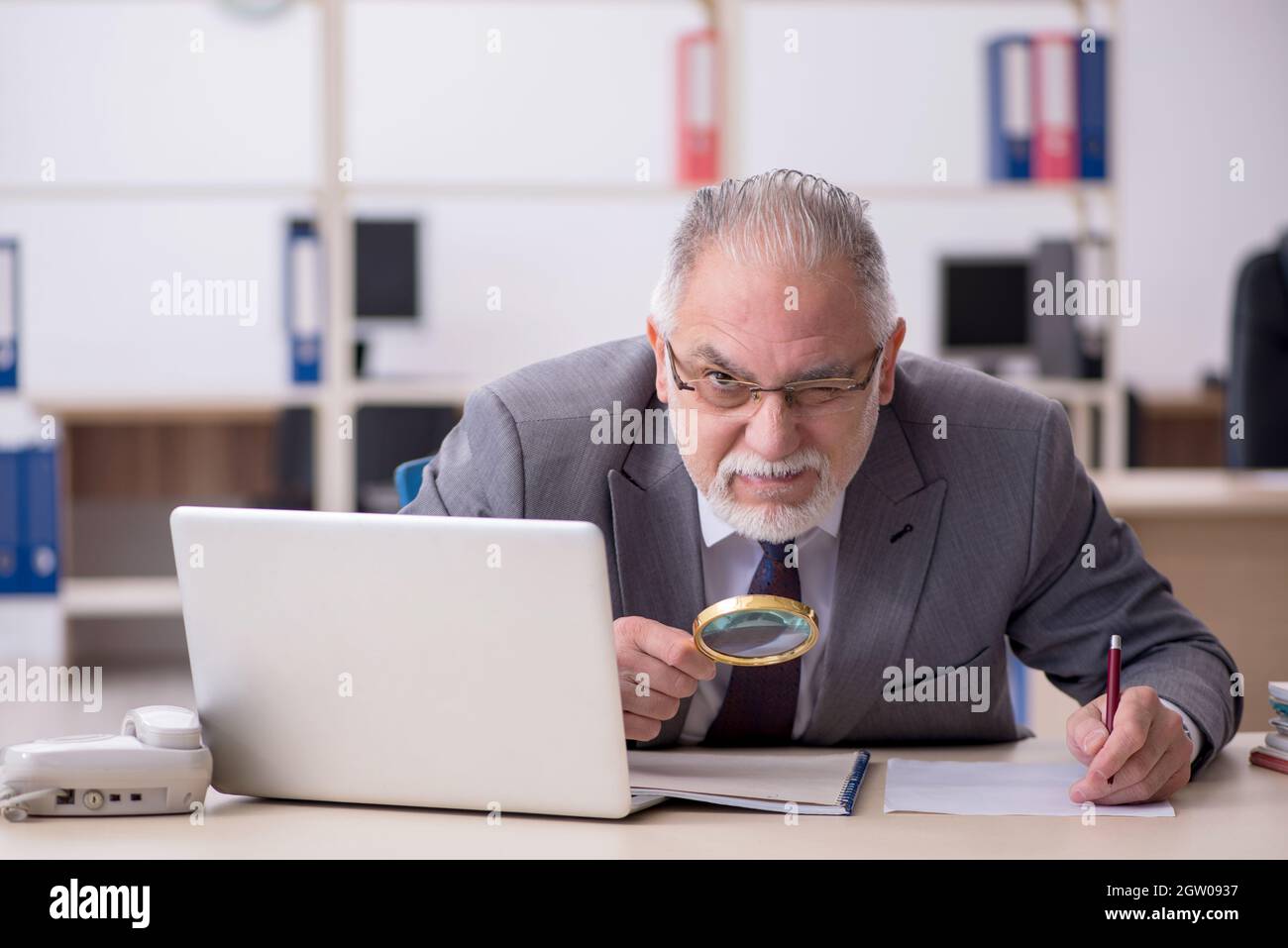 Old auditor working in the office Stock Photo - Alamy