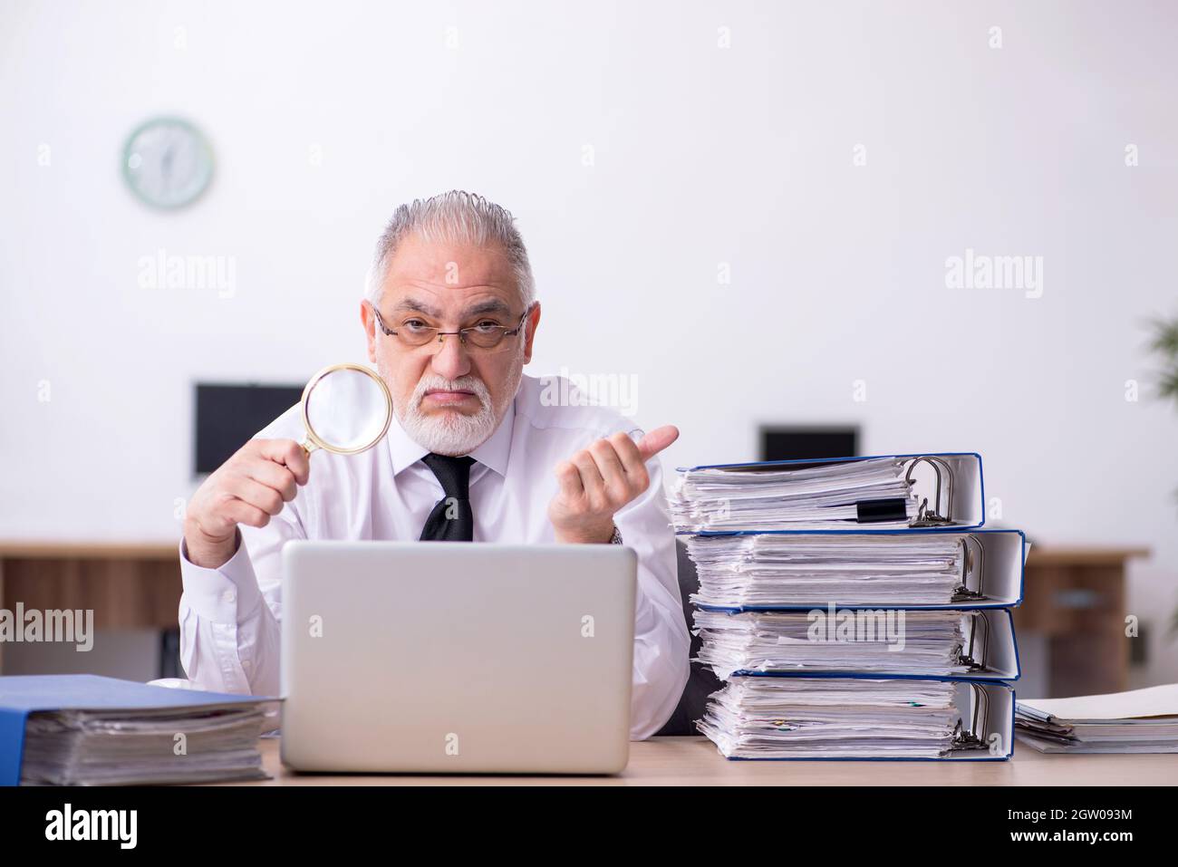 Old auditor working in the office Stock Photo - Alamy