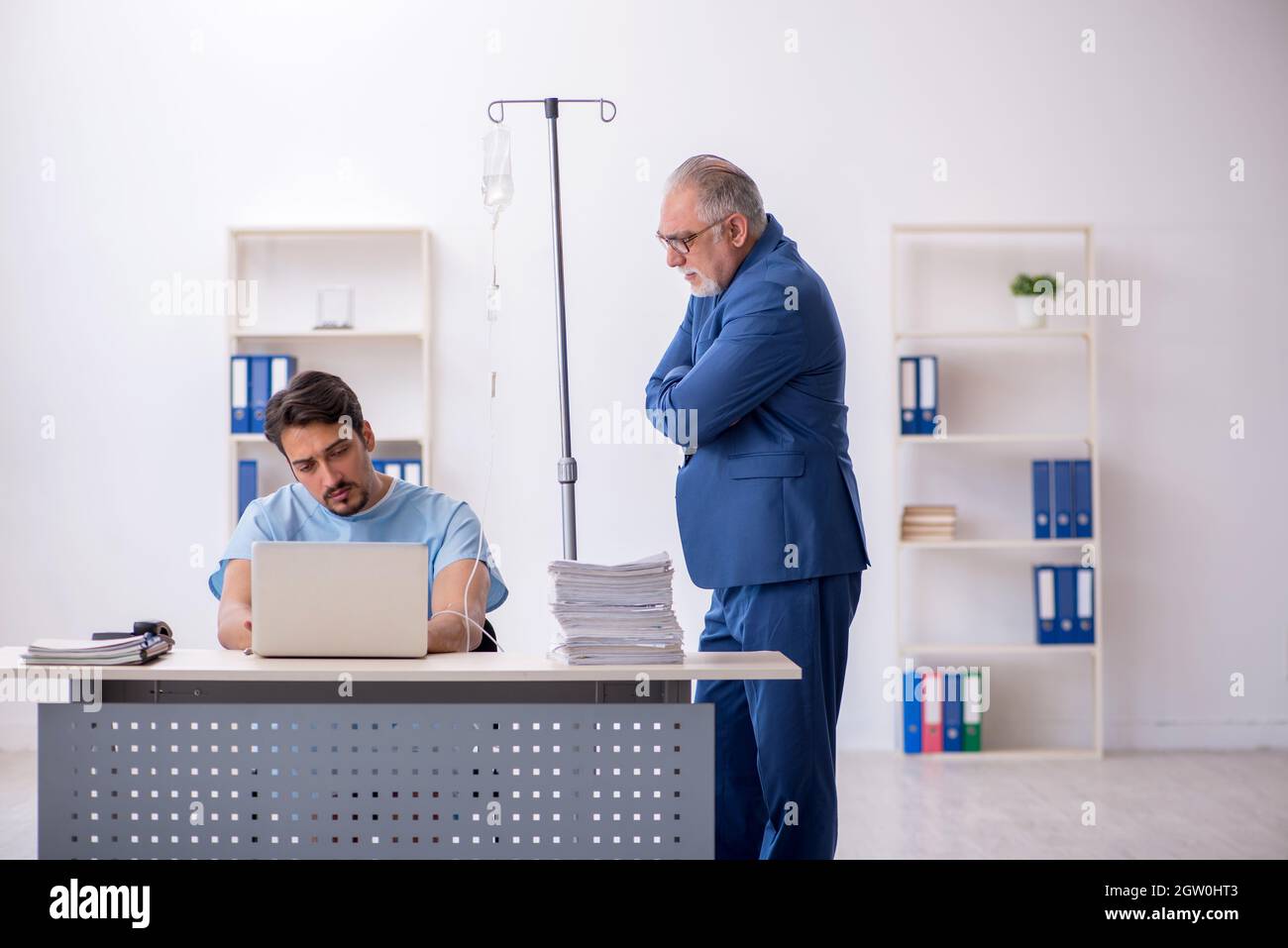 Young employee feeling bad at workplace Stock Photo - Alamy
