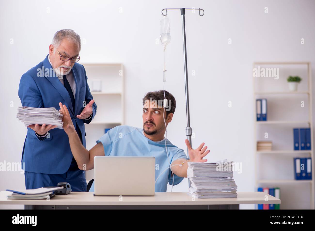 Young employee feeling bad at workplace Stock Photo - Alamy