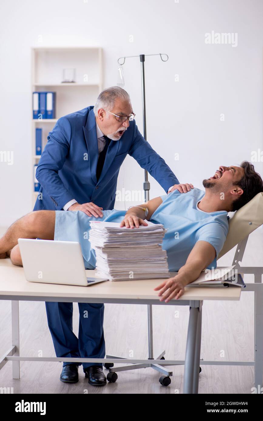 Young employee feeling bad at workplace Stock Photo - Alamy