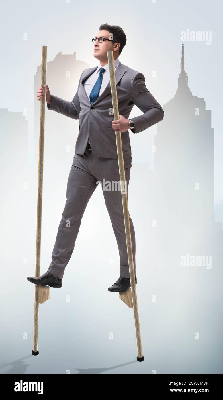 The businessman walking on stilts - standing out from the crowd Stock ...