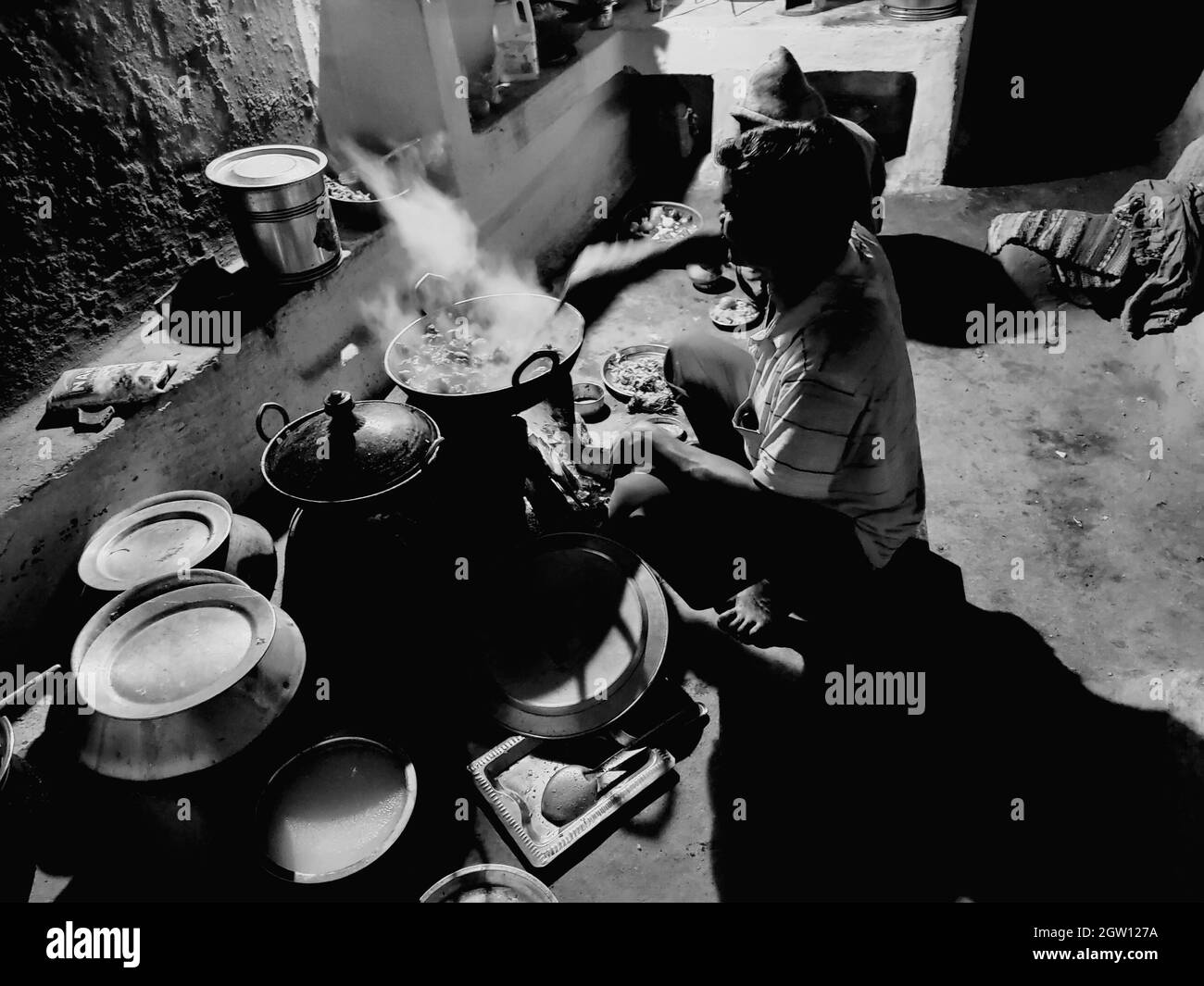 Indian man cooking Black and White Stock Photos & Images - Alamy