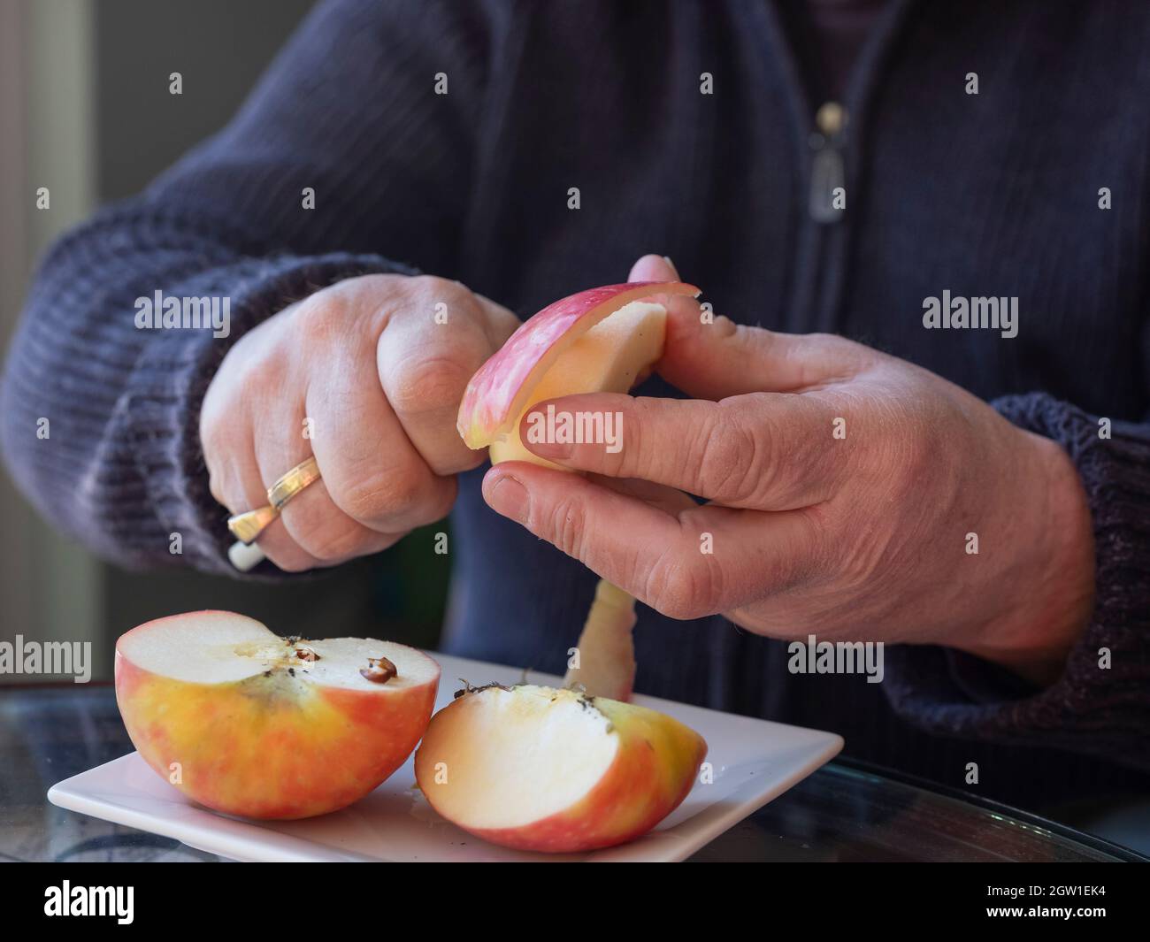 Male peeling apple hi-res stock photography and images - Alamy