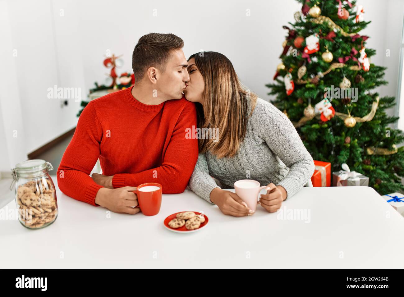 Young couple kissing eating breakfast hi-res stock photography and ...
