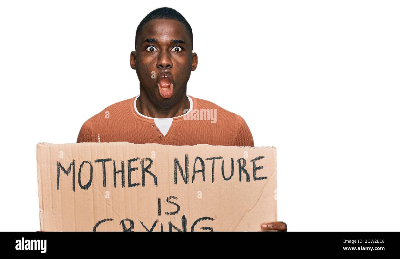 Young african american man holding mother nature is crying protest ...