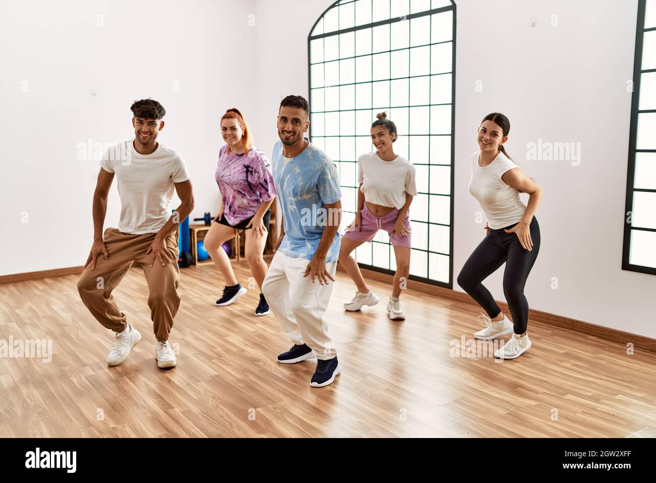 Group of young dancer smiling happy dancing choreography at dance ...