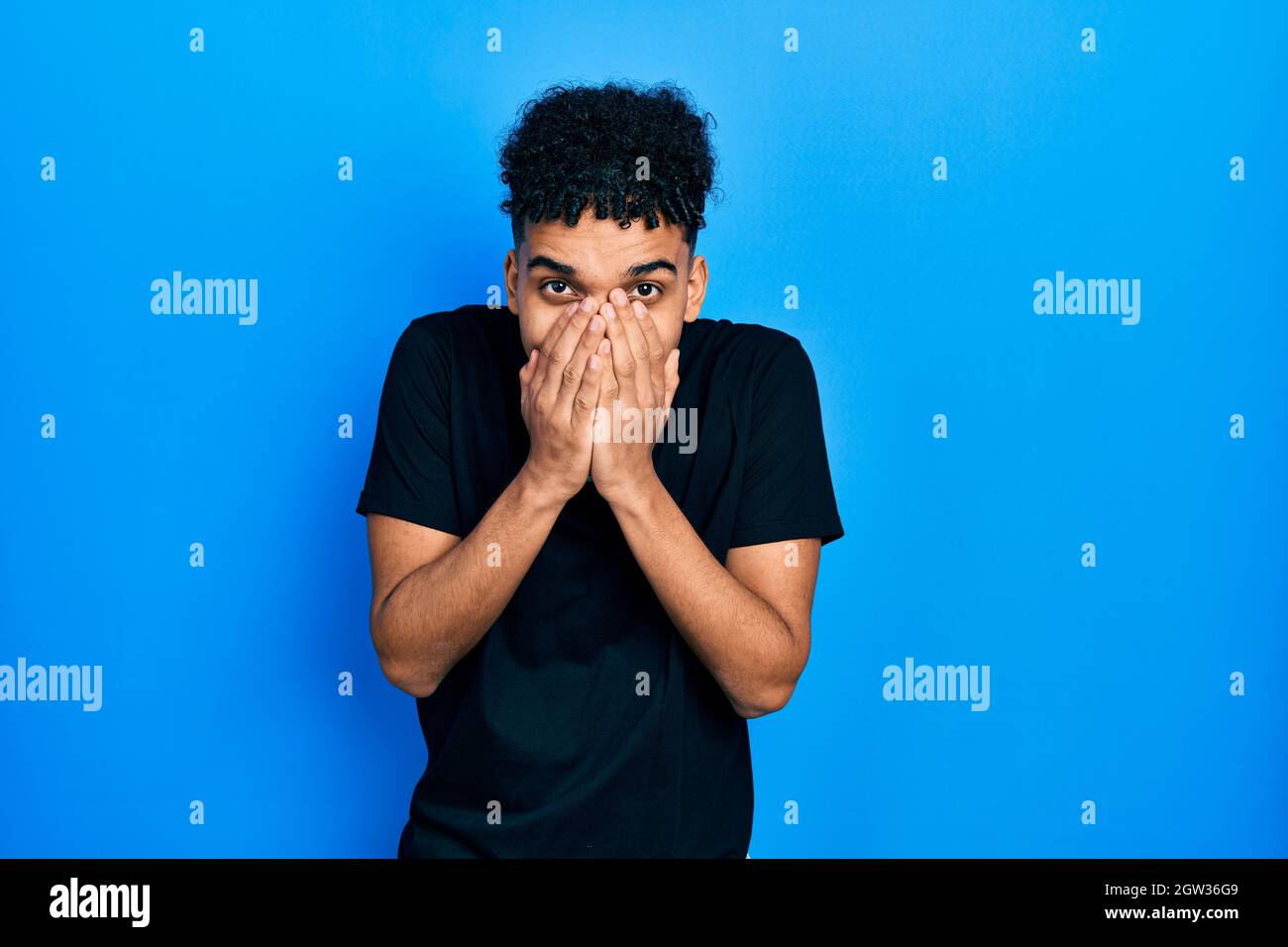 Young african american man wearing staff t shirt laughing and ...