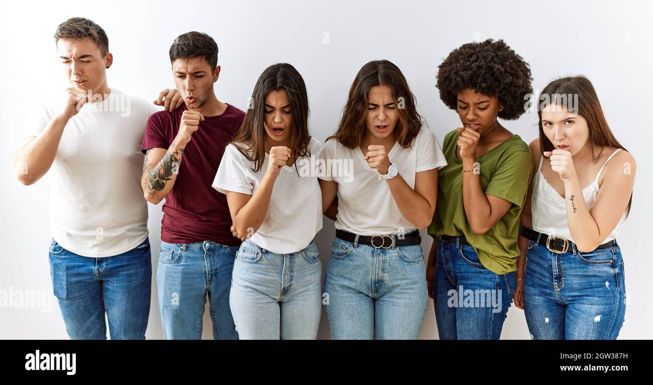 Group of young friends standing together over isolated background ...