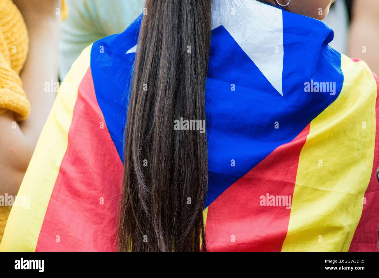 Multi Colored Flag Against Blue Sky Stock Photo - Alamy