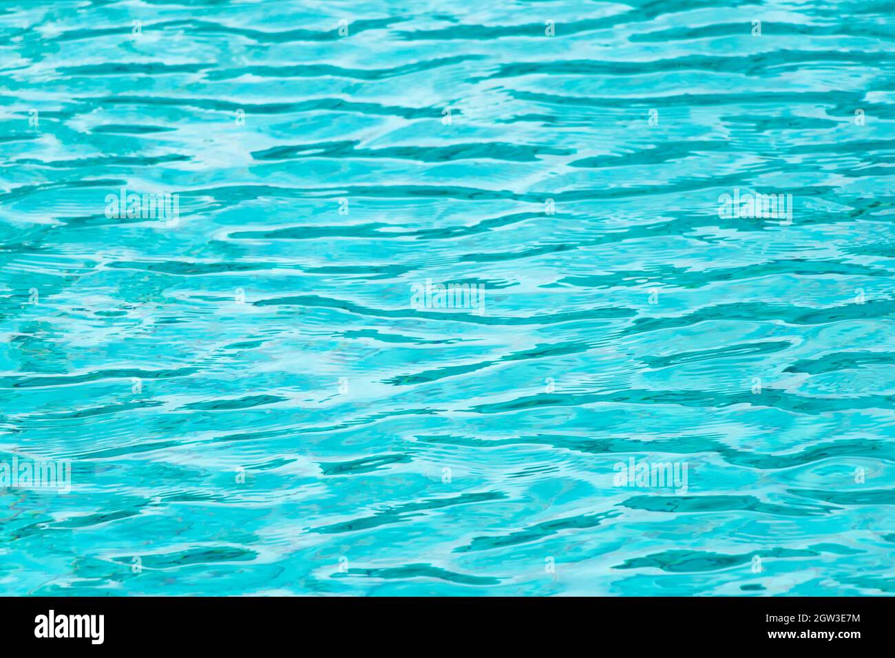Ripple Water in swimming pool with blue tile floor background Stock ...