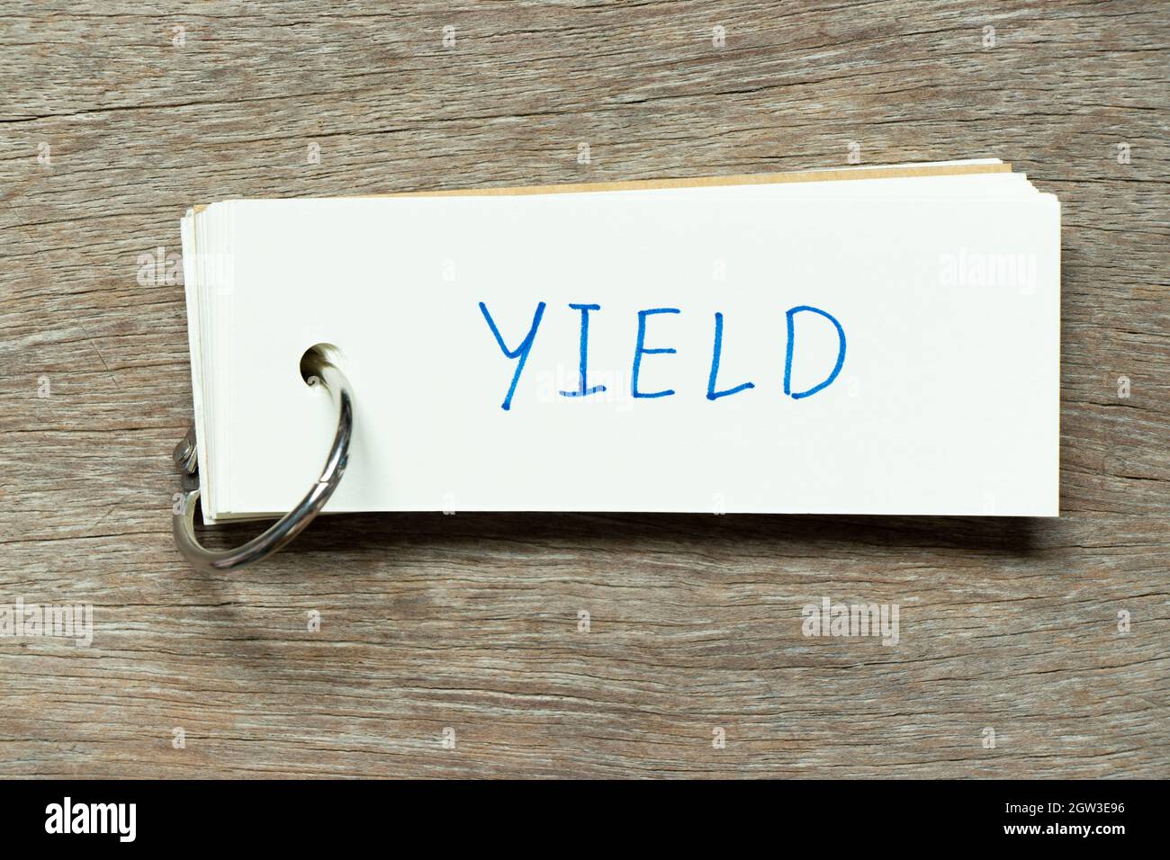 Flash card with handwriting word yield on wood background Stock Photo ...