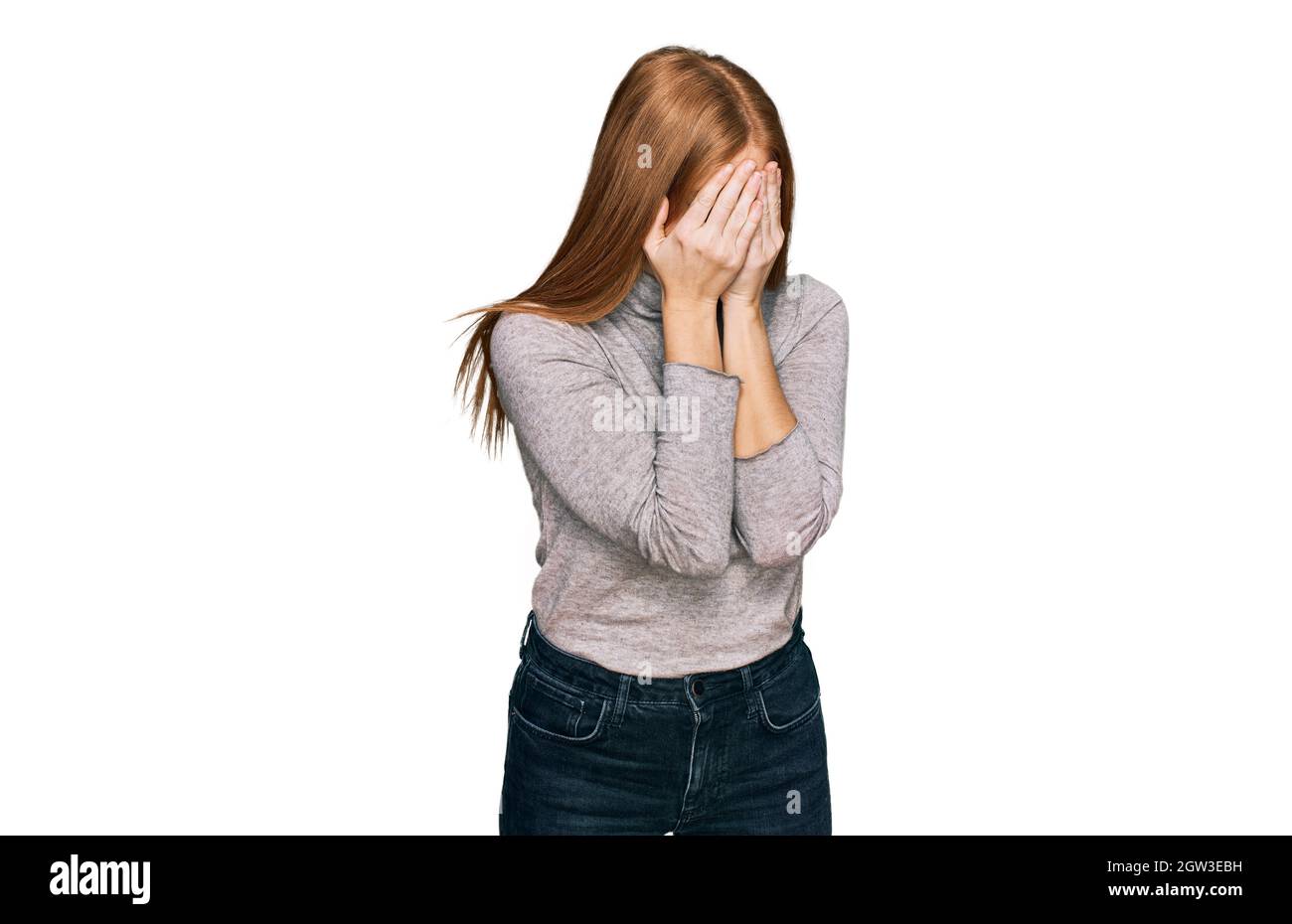 Young irish woman wearing casual clothes with sad expression covering ...