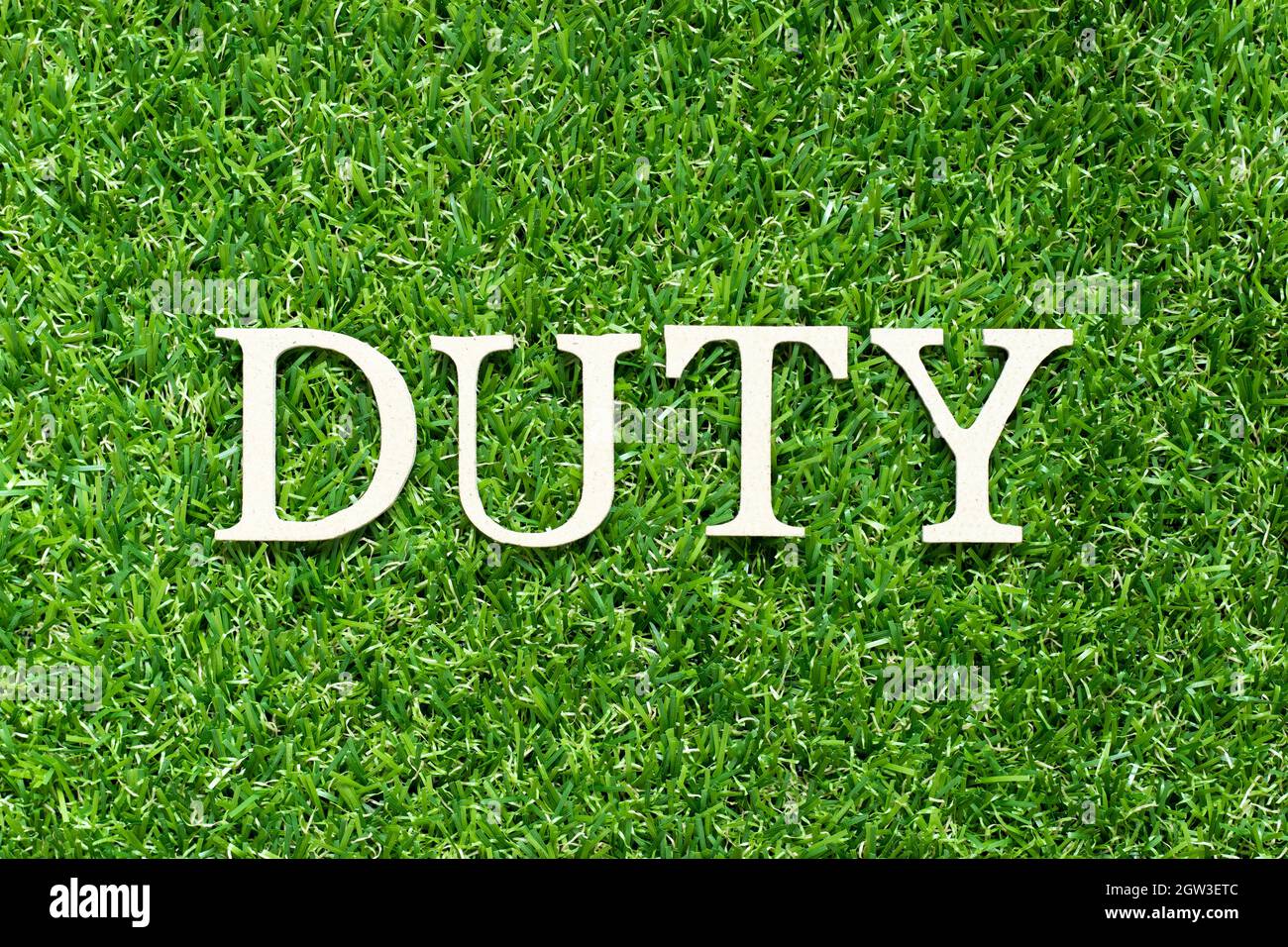 Alphabet letter in word duty on green grass background Stock Photo - Alamy