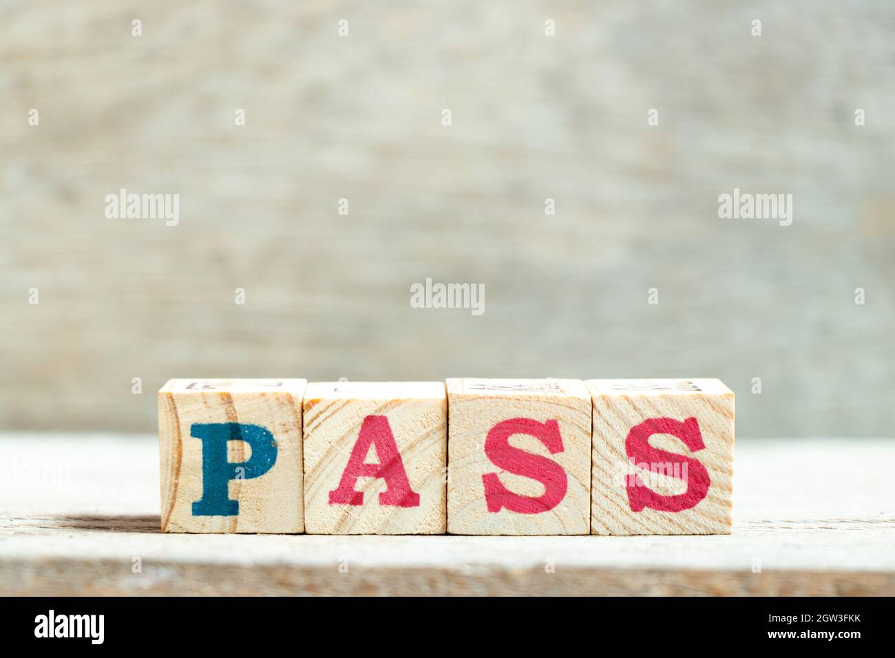 Alphabet letter block in word pass on wood background Stock Photo - Alamy