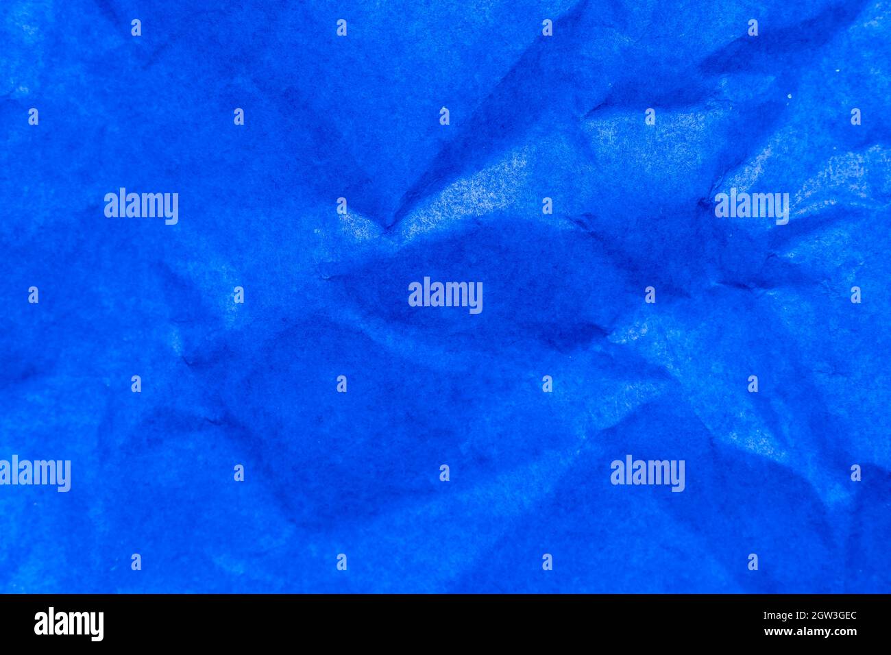 Grunge wrinkled blue color paper textured background Stock Photo - Alamy
