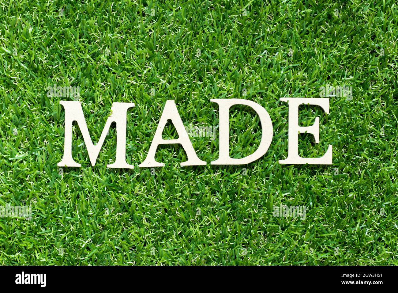 Alphabet letter in word made on green grass background Stock Photo - Alamy