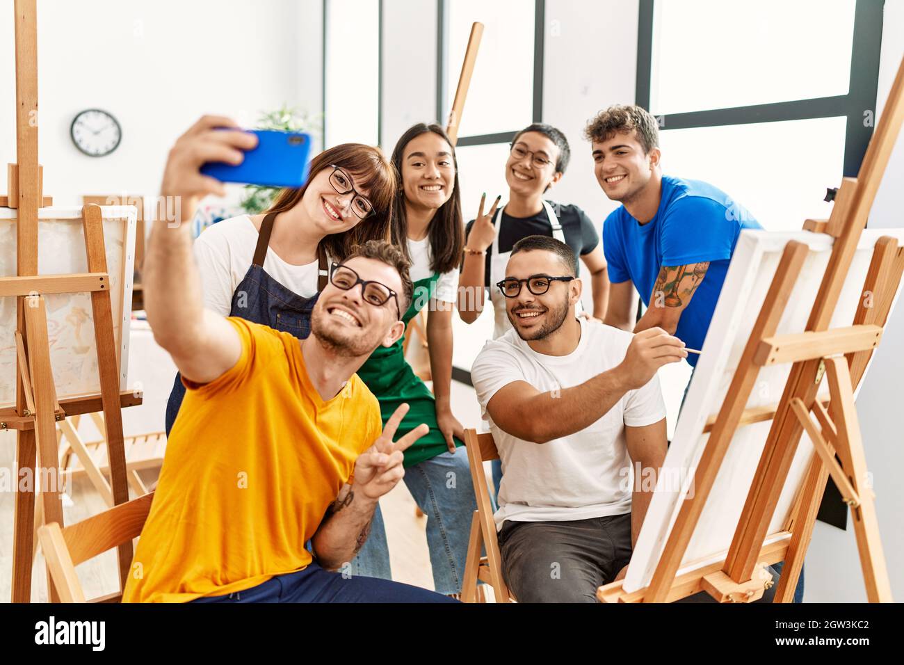 Group of people smiling happy drawing at art studio Stock Photo - Alamy