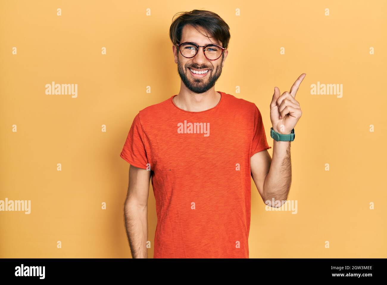 Young hispanic man wearing casual clothes and glasses with a big smile ...