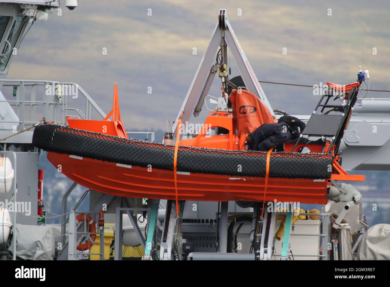 A dayglo orange Sjobjorn 23 (Seabear 23) RHIB carried aboard KNM Olav ...