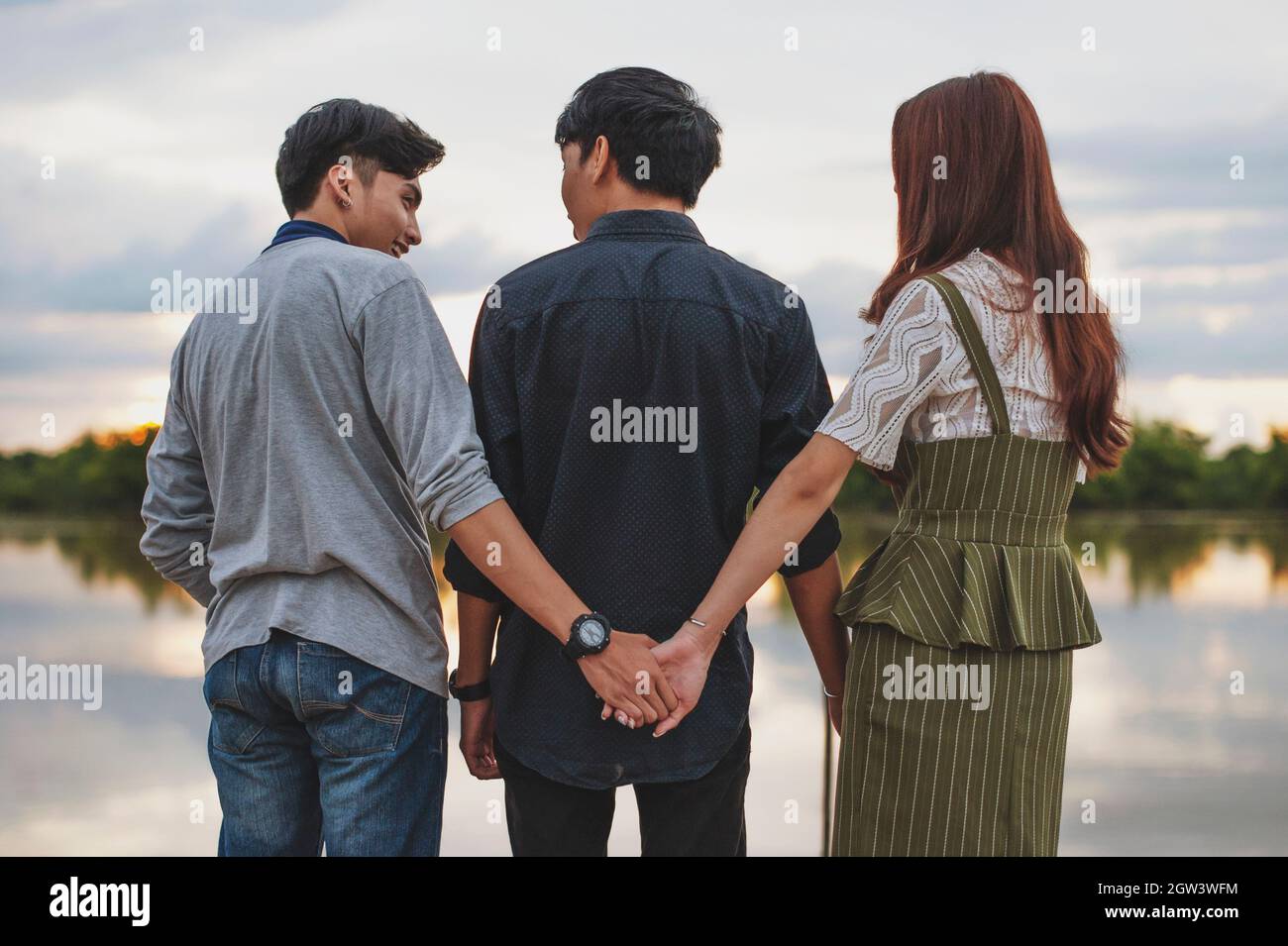 Love triangle two men and one woman hi-res stock photography and images ...