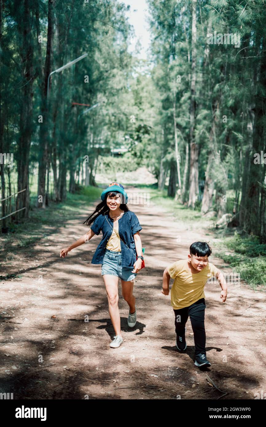 Boy running after mother hi-res stock photography and images - Alamy