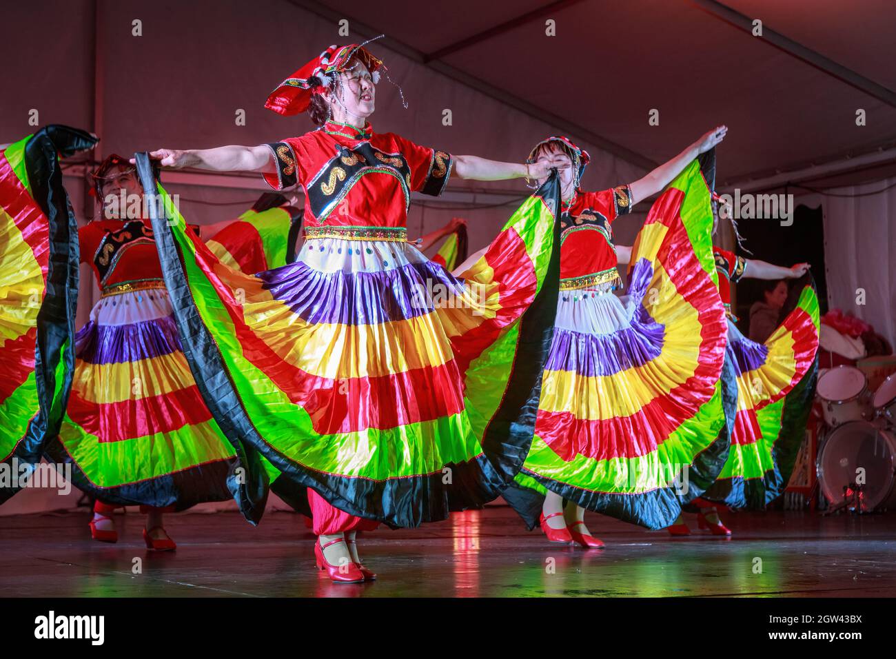 Uyghur folk dancers from the Xinjiang region of China performing on ...