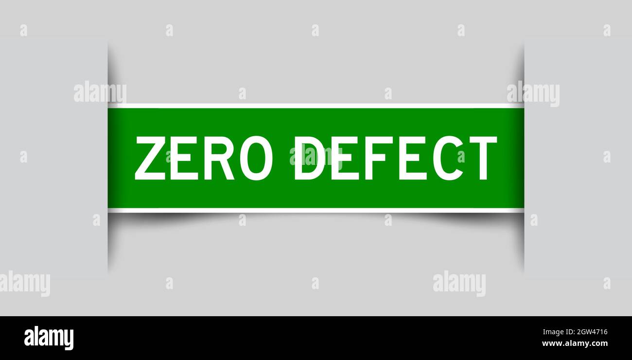 Inserted green color label sticker with word zero defect on gray ...