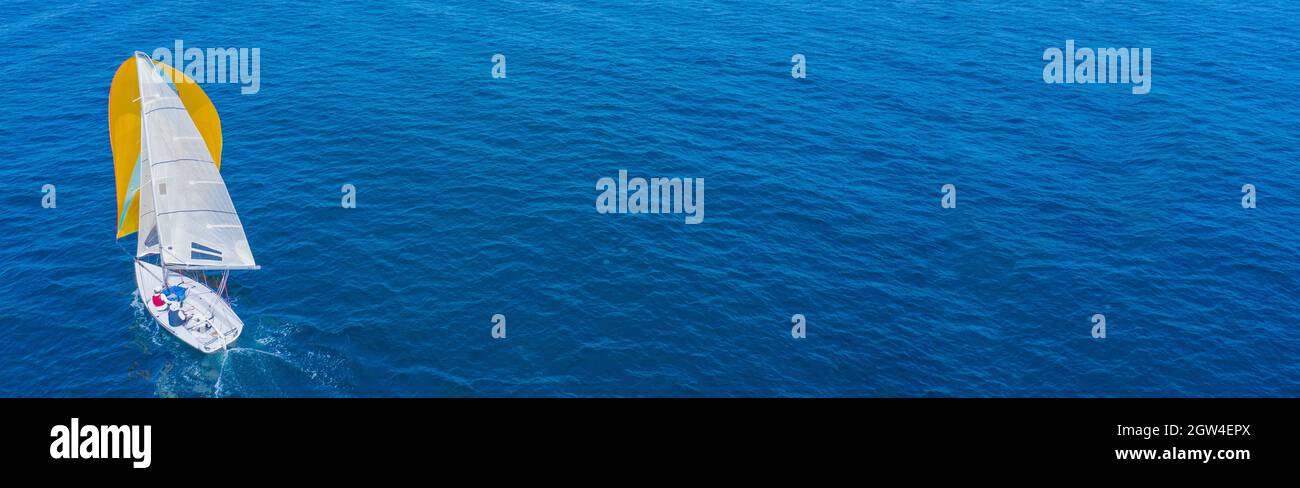 Summer vacation on the water. Aerial view of a beautiful white sailing ...