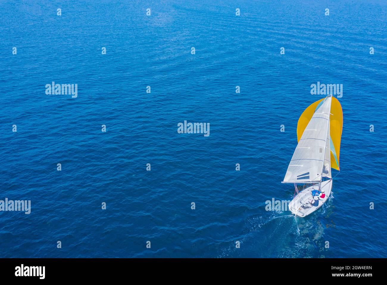 Summer vacation on the water. Aerial view of a beautiful white sailing ...