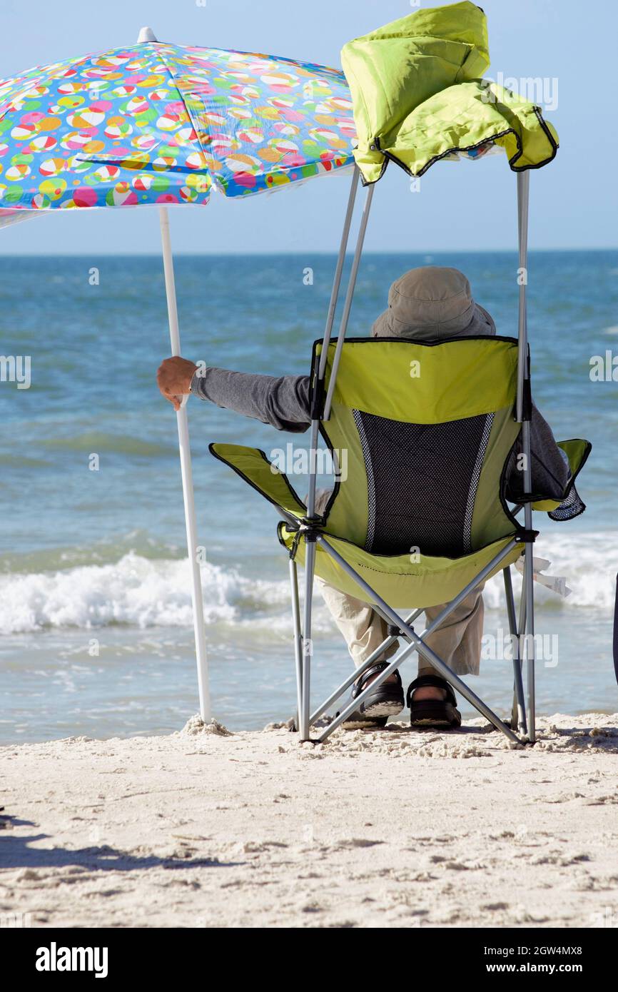 Elderly people sitting on seat rear view hi-res stock photography and ...