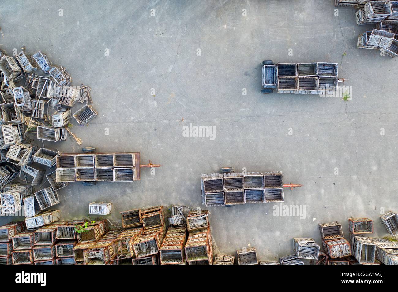 Lots of wooden boxes on the asphalt site. Aerial view Stock Photo - Alamy