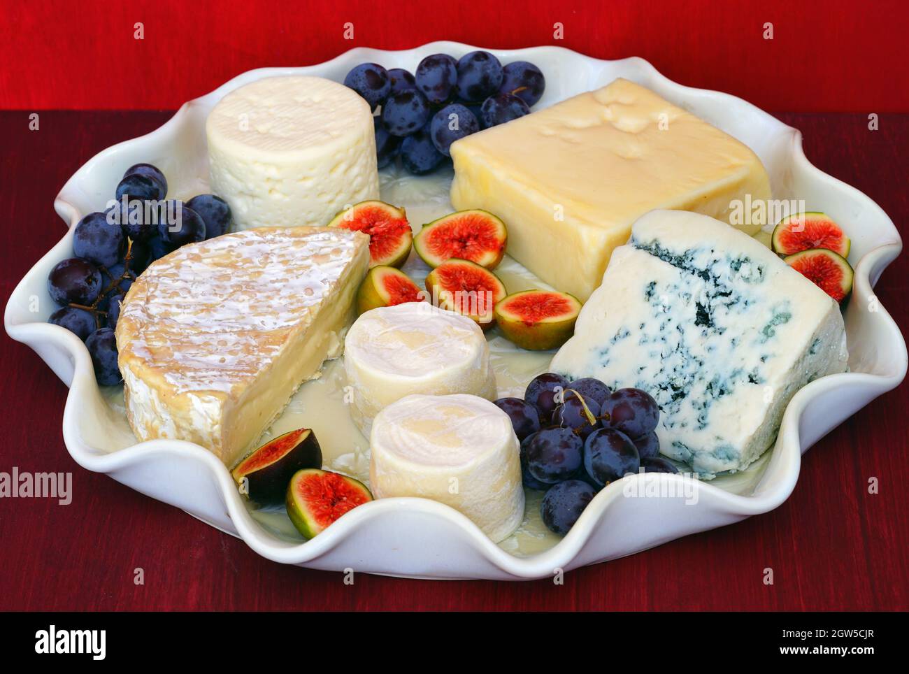 Cheese platter with camembert, goat cheese, blue cheese, fresh figs and ...