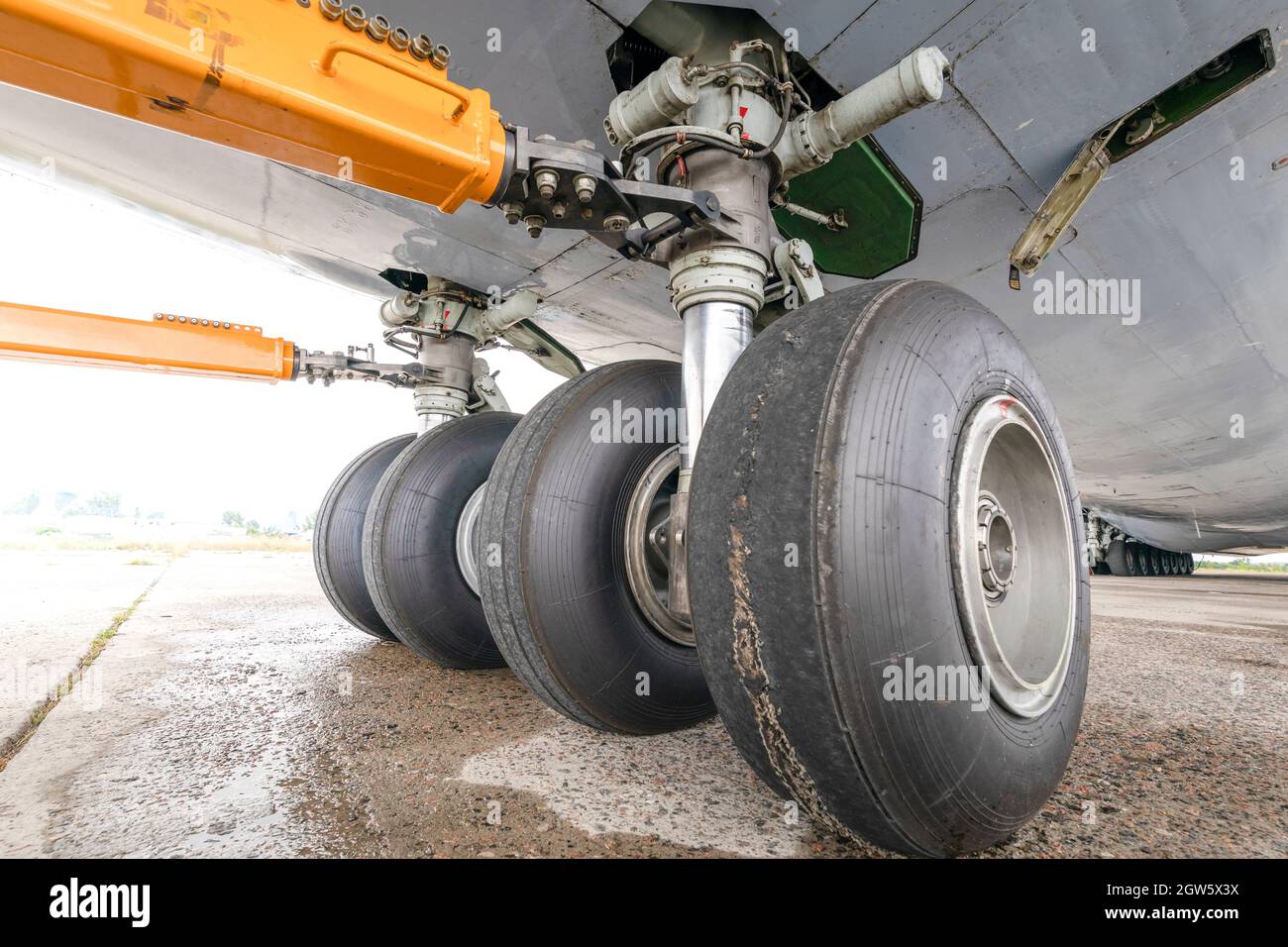 Worn cargo plane chassis. Damaged rubber tire as a result of prolonged ...