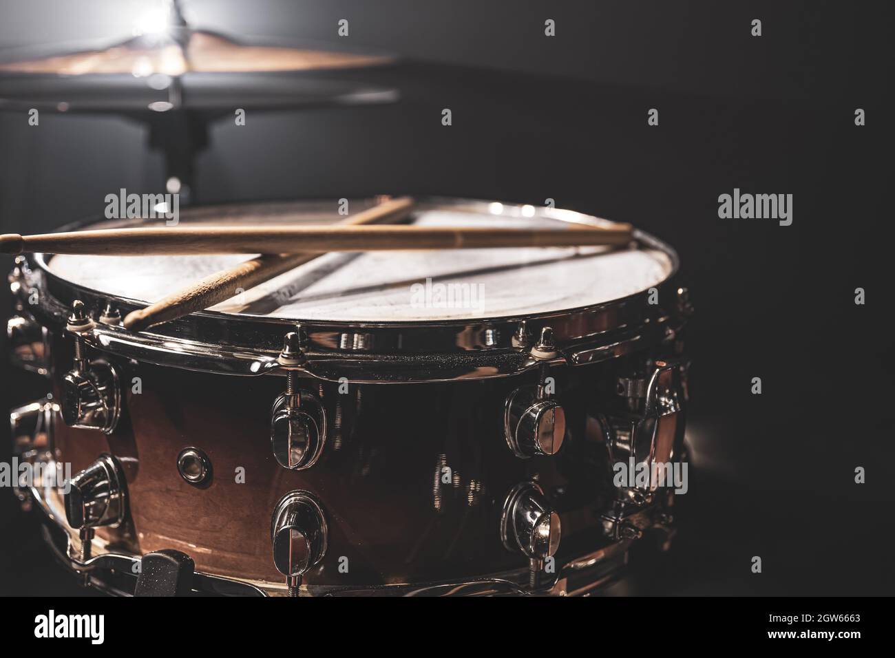 Snare drum, percussion instrument on a dark background with stage ...
