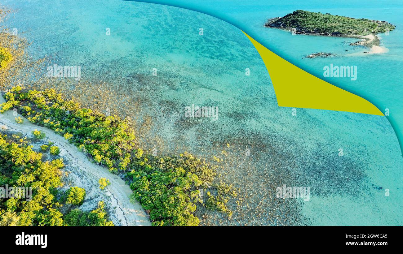 Aerial over the ocean at low tide showing underwater detail and coastal ...