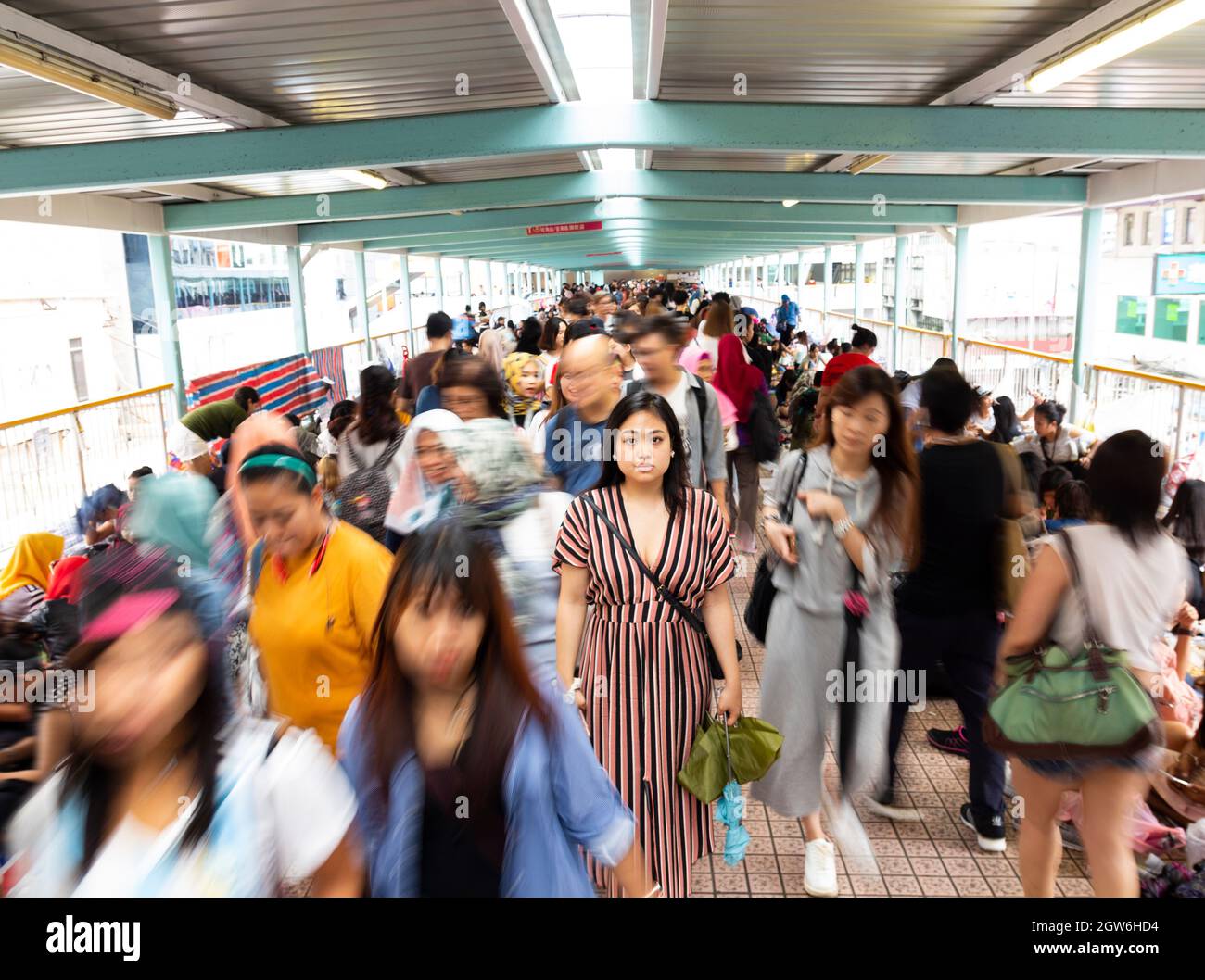 One person standing in blurred crowd hi-res stock photography and ...