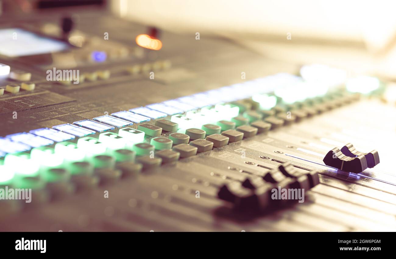 Sound mixer. Professional audio mixing console with lights, buttons ...