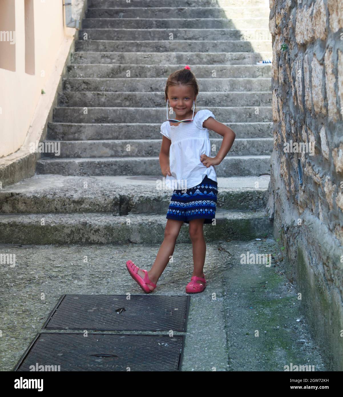 Full Length Portrait Of Girl Standing On Staircase Stock Photo - Alamy