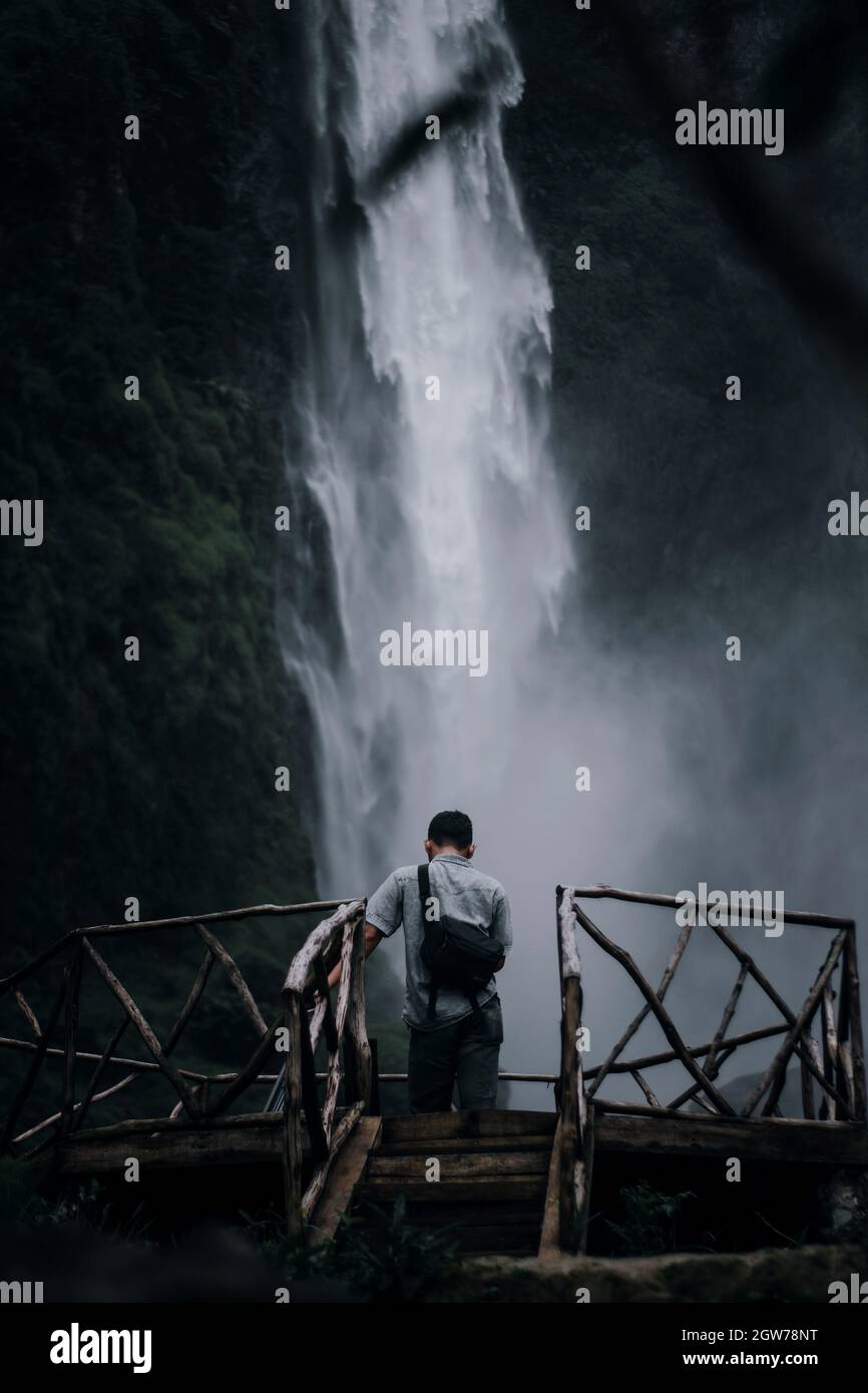 Young man standing railing observation hi-res stock photography and ...