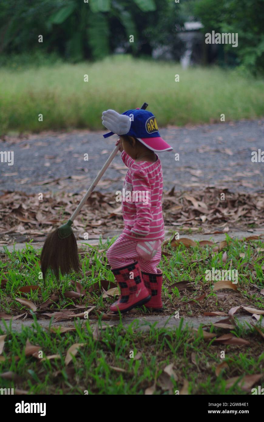 Girl With A Broom Outdoor Stock Photo - Alamy