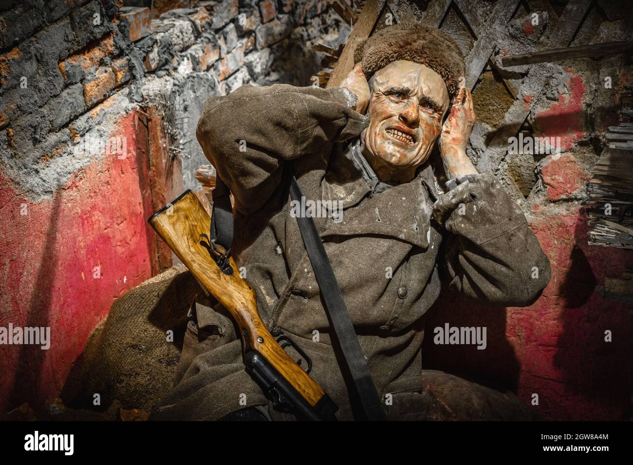 Soviet soldier covering his ears to avoid hearing loss. WWII historical ...