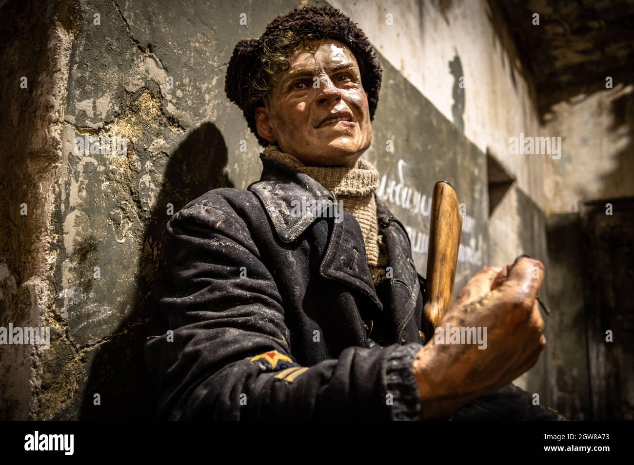 Smiling Soviet soldier holding a grenade pin. Front view. WWII ...