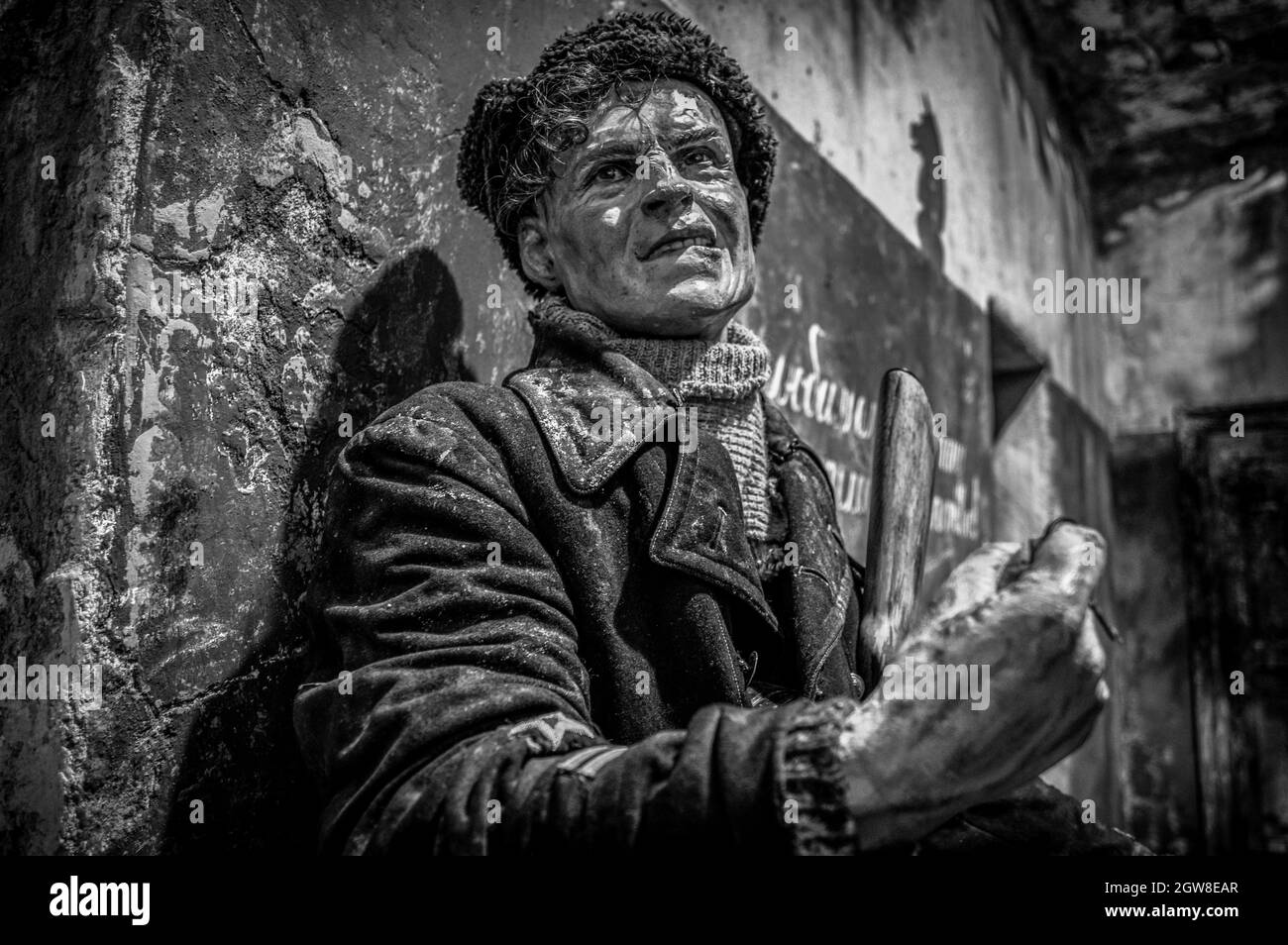Smiling Soviet soldier holding a grenade pin. Front view. WWII ...