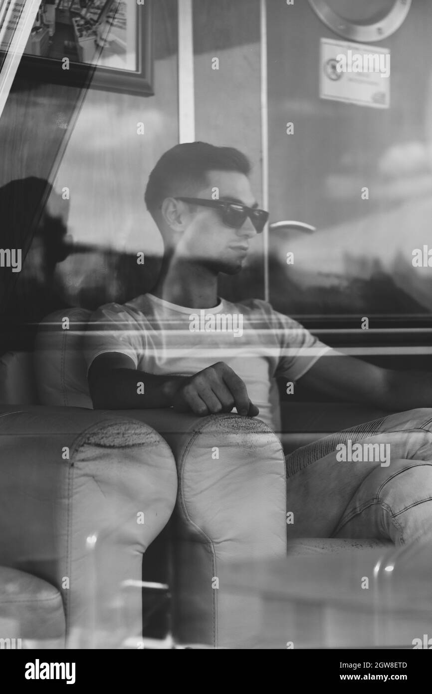 Young man reflection window Black and White Stock Photos & Images - Alamy