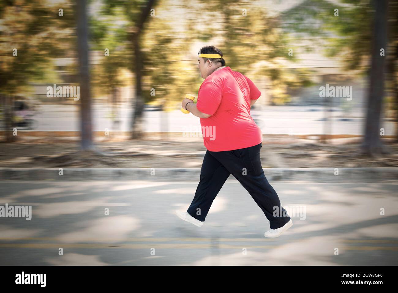 Overweight young asian man running hi-res stock photography and images ...
